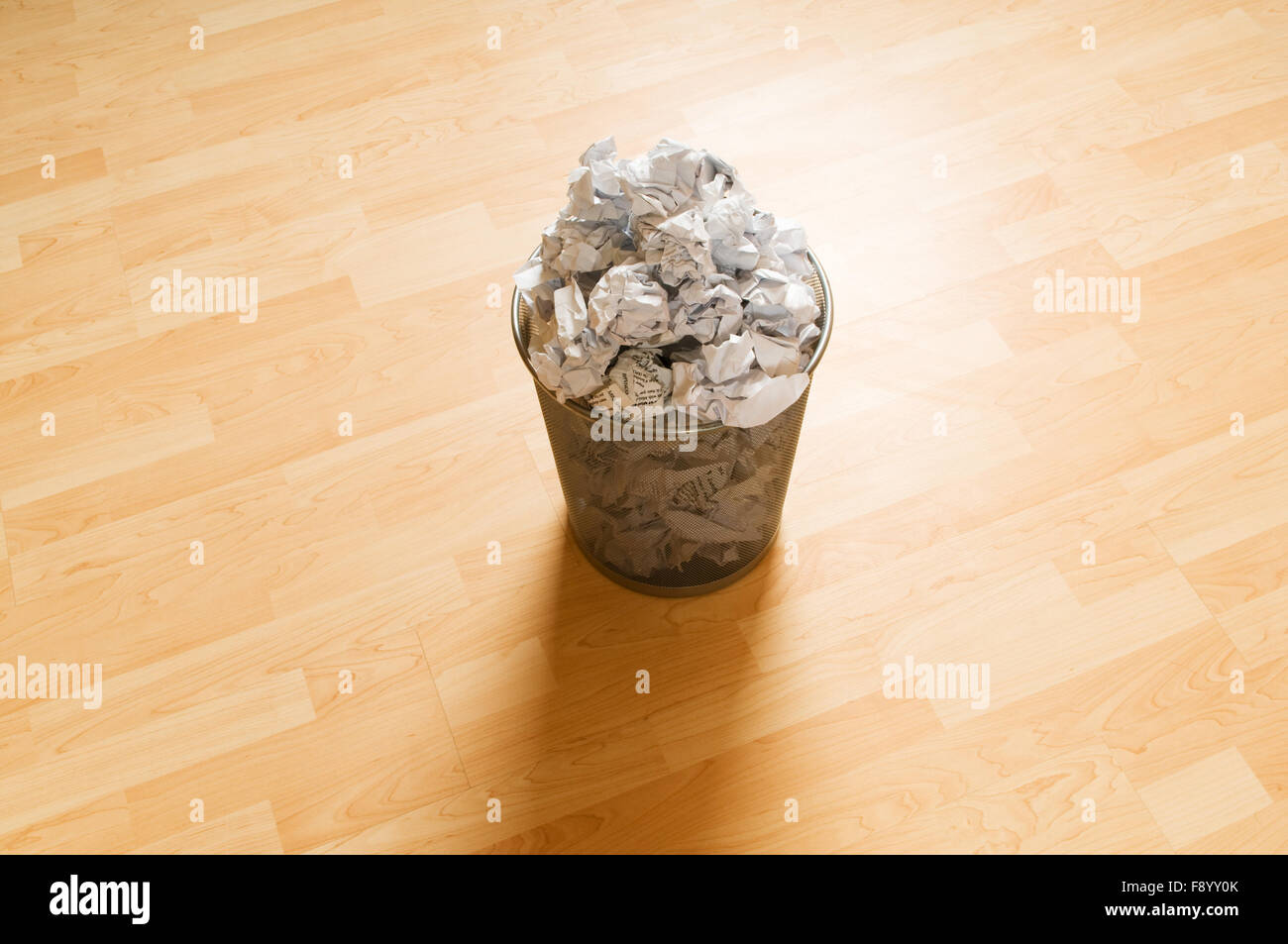 Garbage bin with paper waste isolated on white Stock Photo - Alamy
