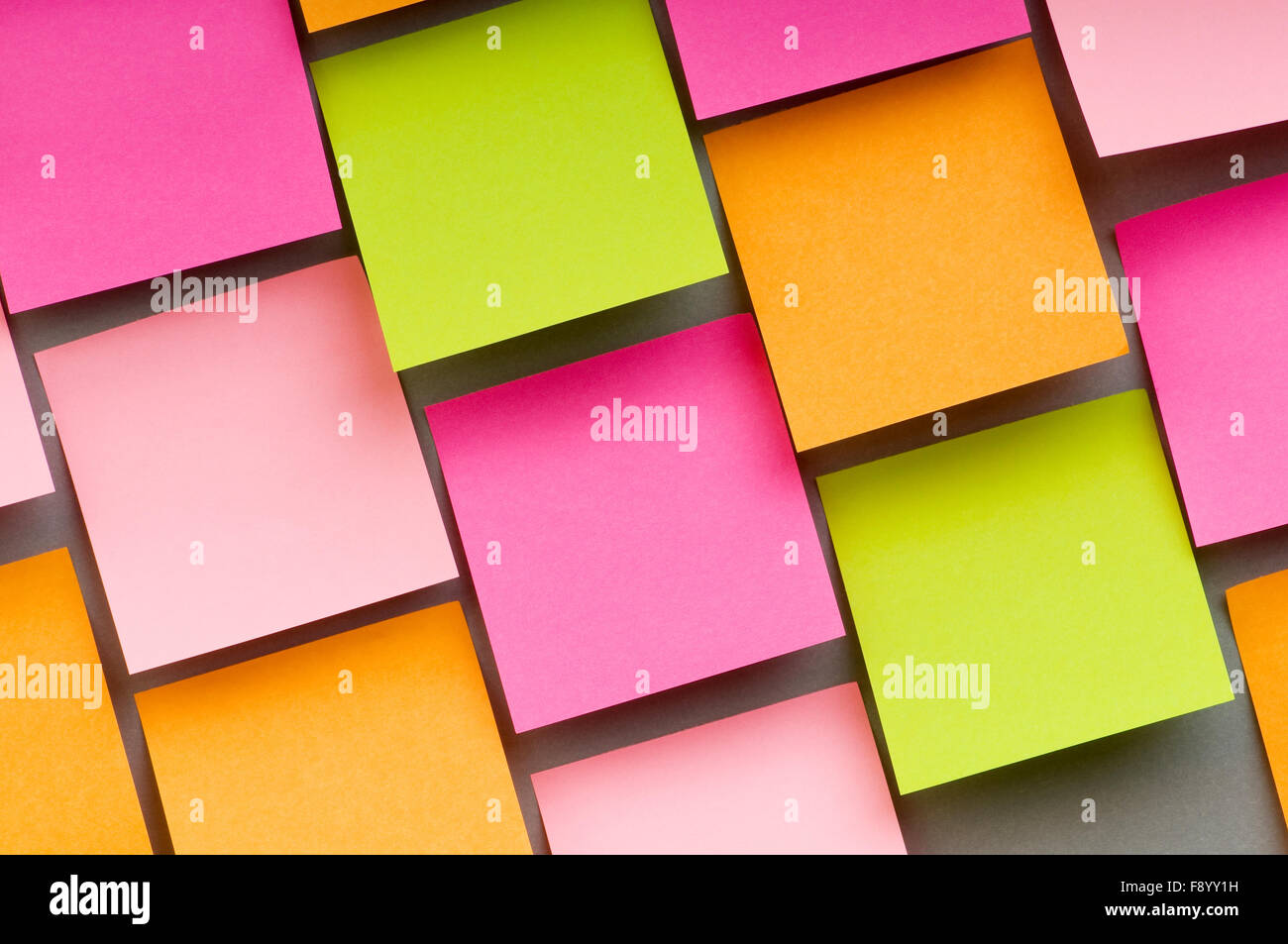 Reminder notes on the bright colorful paper Stock Photo - Alamy