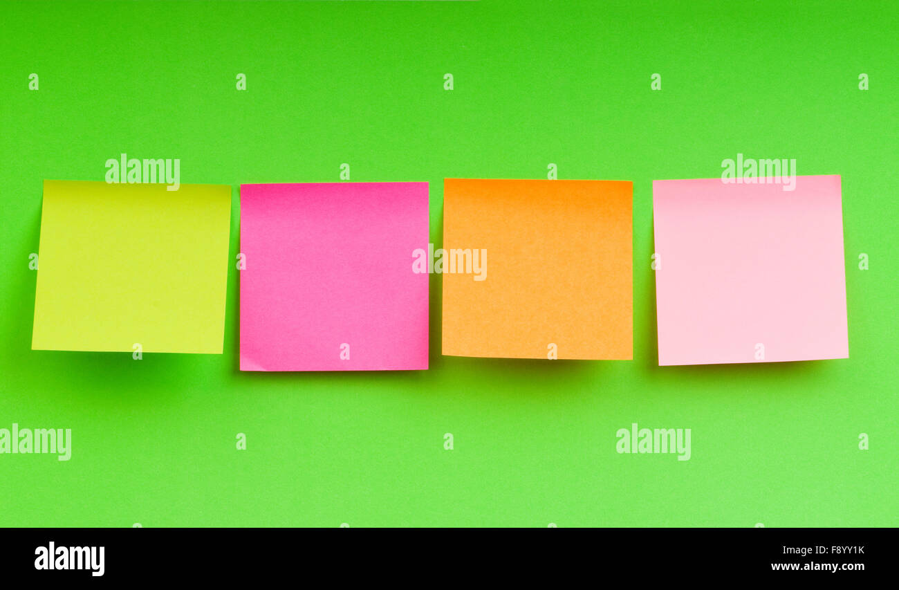 Reminder notes on the bright colorful paper Stock Photo - Alamy