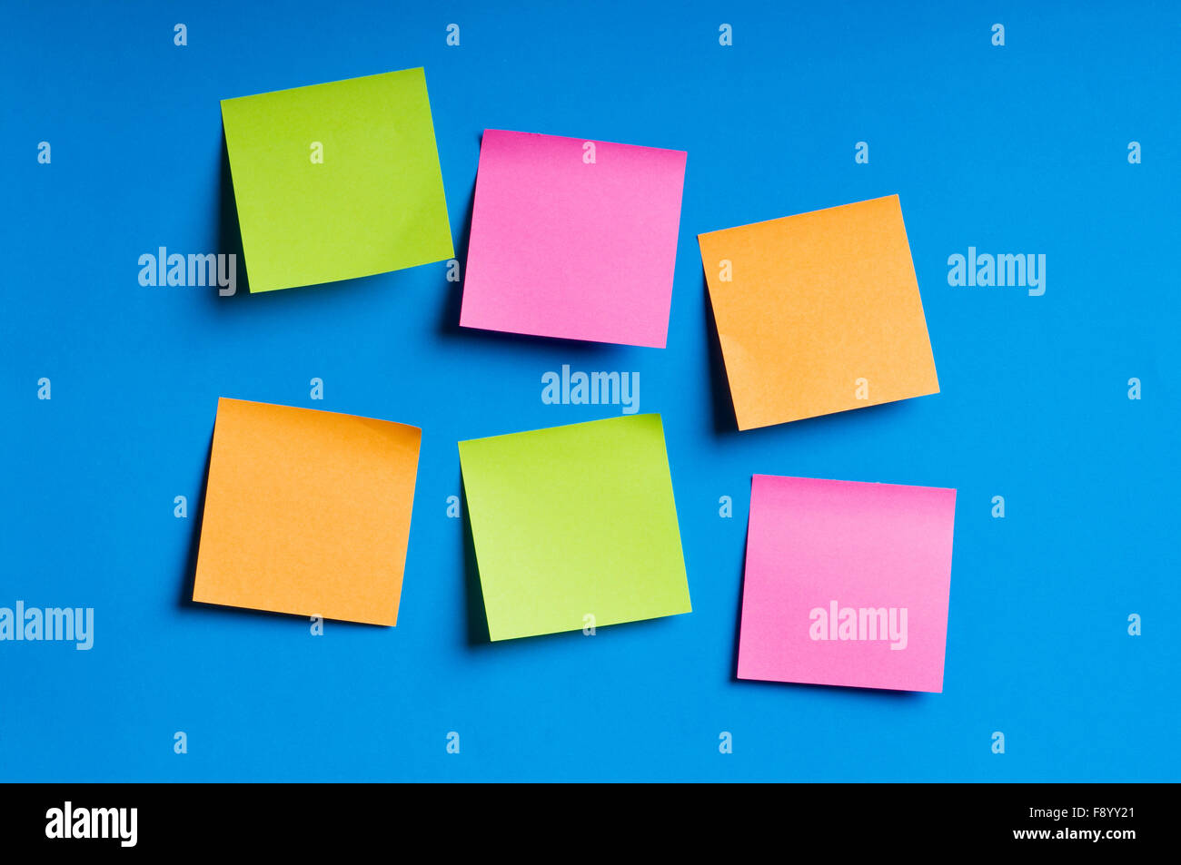 Reminder notes on the bright colorful paper Stock Photo - Alamy