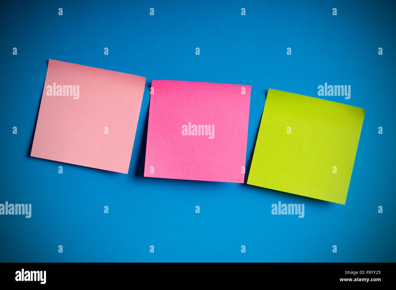 Reminder notes on the bright colorful paper Stock Photo - Alamy