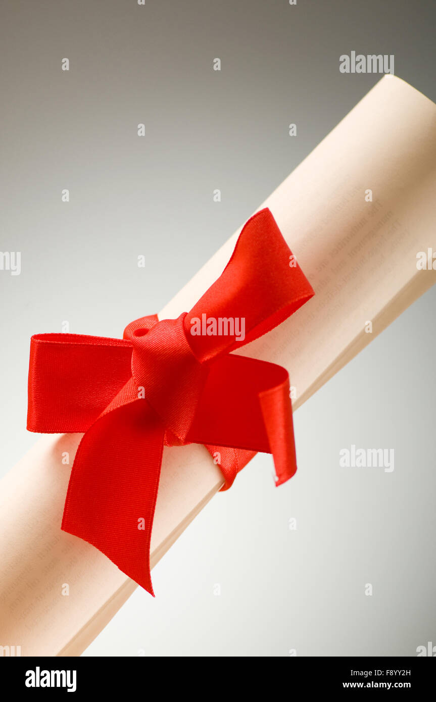 Education concept - diploma roll on the wooden table Stock Photo - Alamy