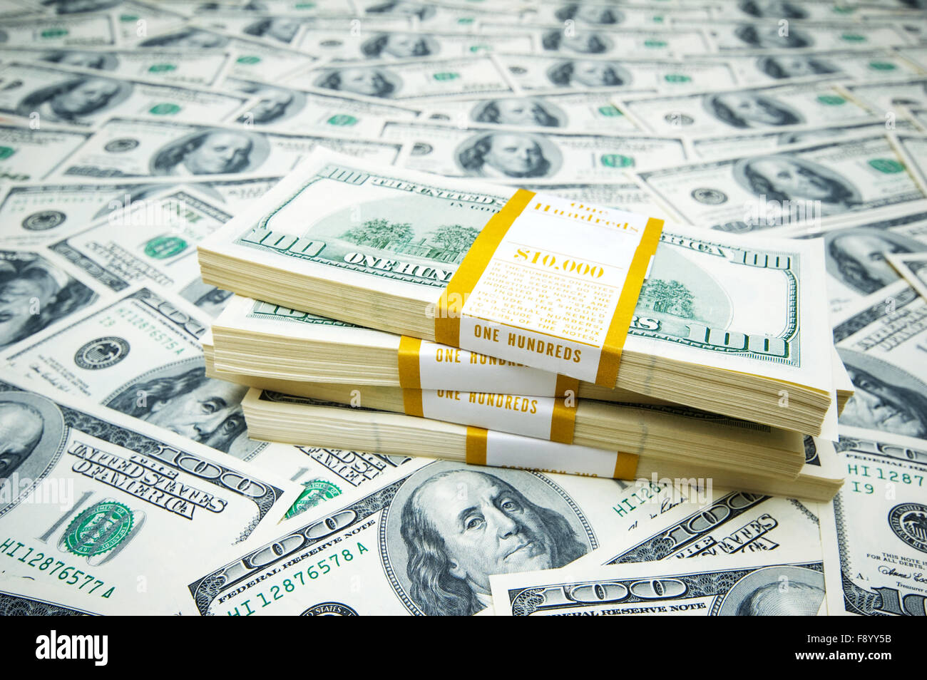 Stack of dollars on money background Stock Photo - Alamy