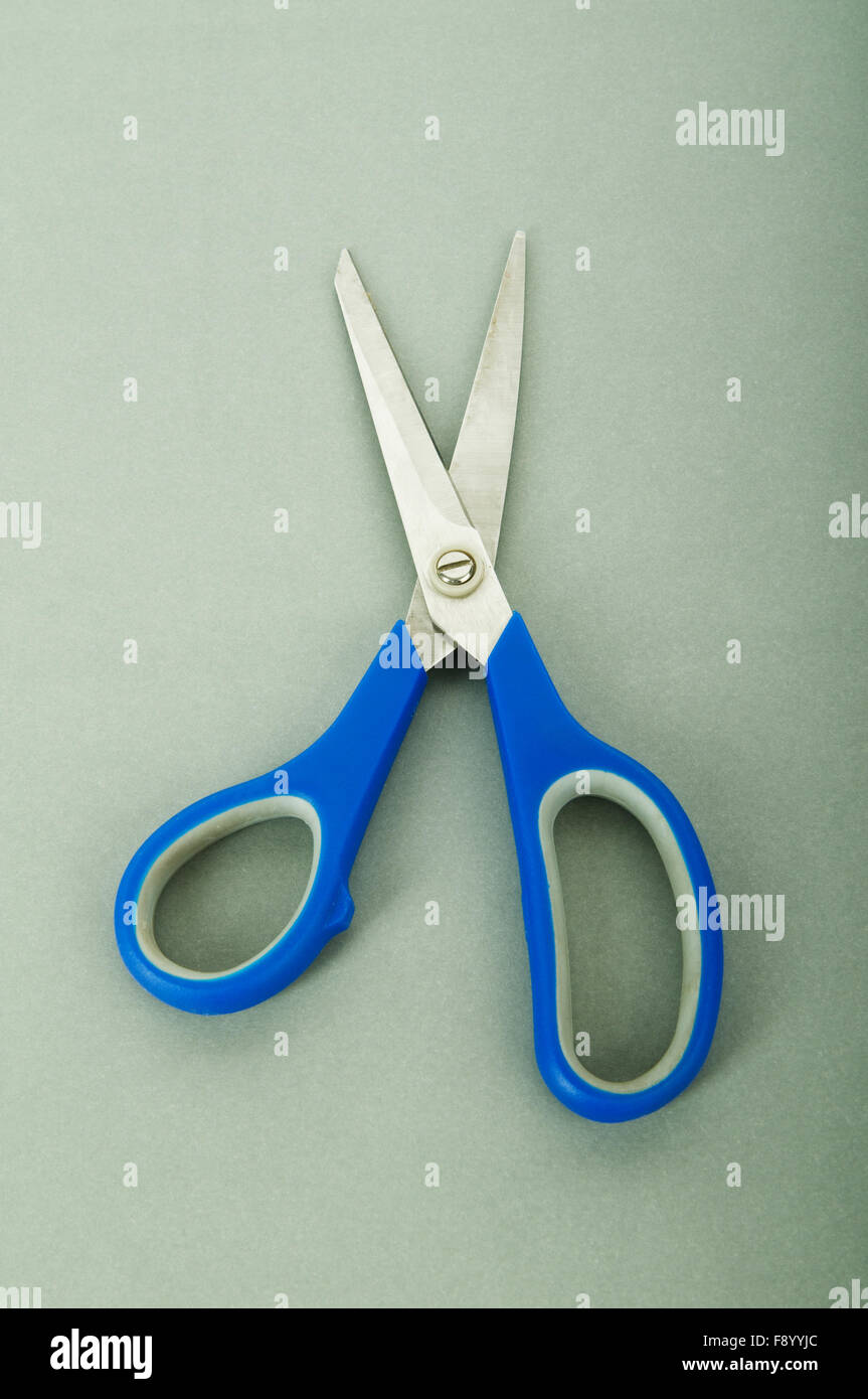 Colorful scissors on the color paper background Stock Photo - Alamy