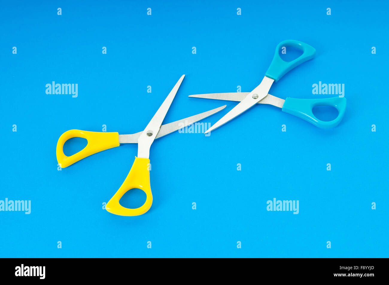 Colorful scissors on the color paper background Stock Photo - Alamy