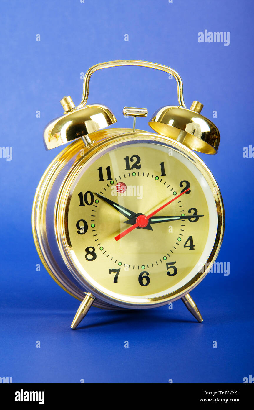 Time concept - alarm clock against colorful background Stock Photo - Alamy