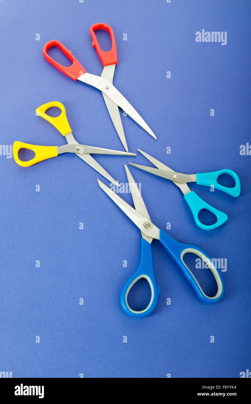 Colorful scissors on the color paper background Stock Photo - Alamy