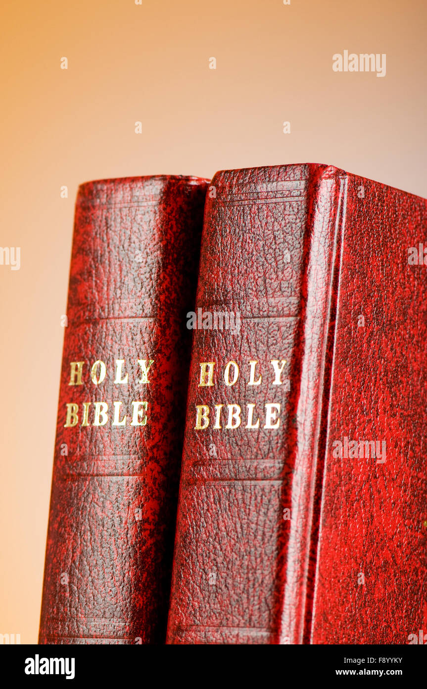Bible books against the colorful gradient background Stock Photo - Alamy