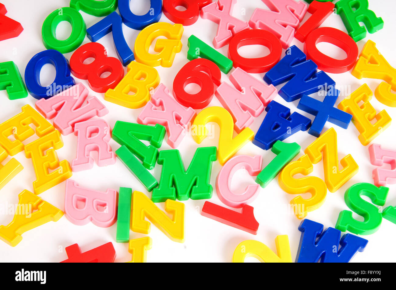 Children letters and digits on the table Stock Photo - Alamy