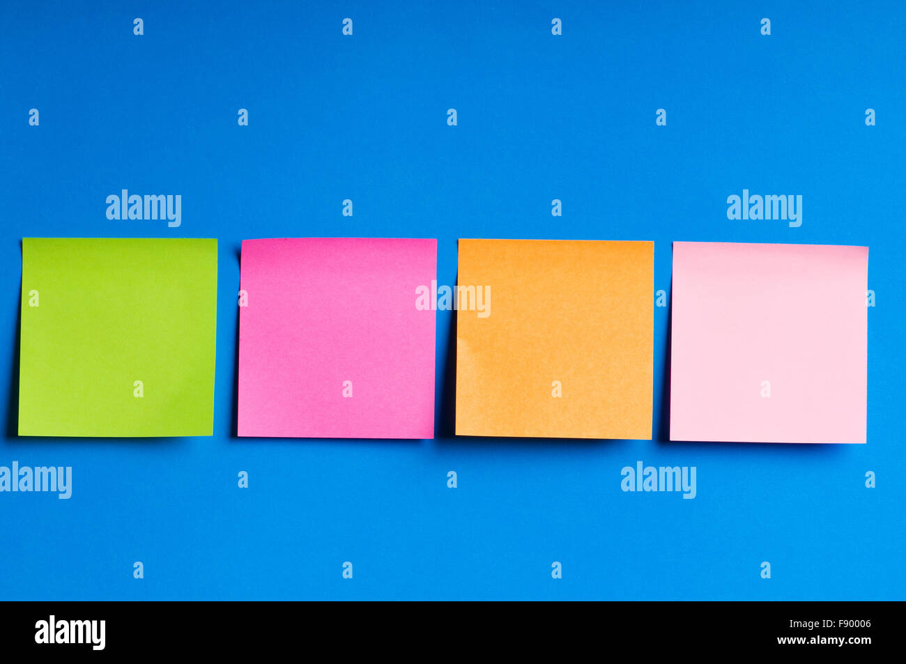 Reminder notes on the bright colorful paper Stock Photo - Alamy