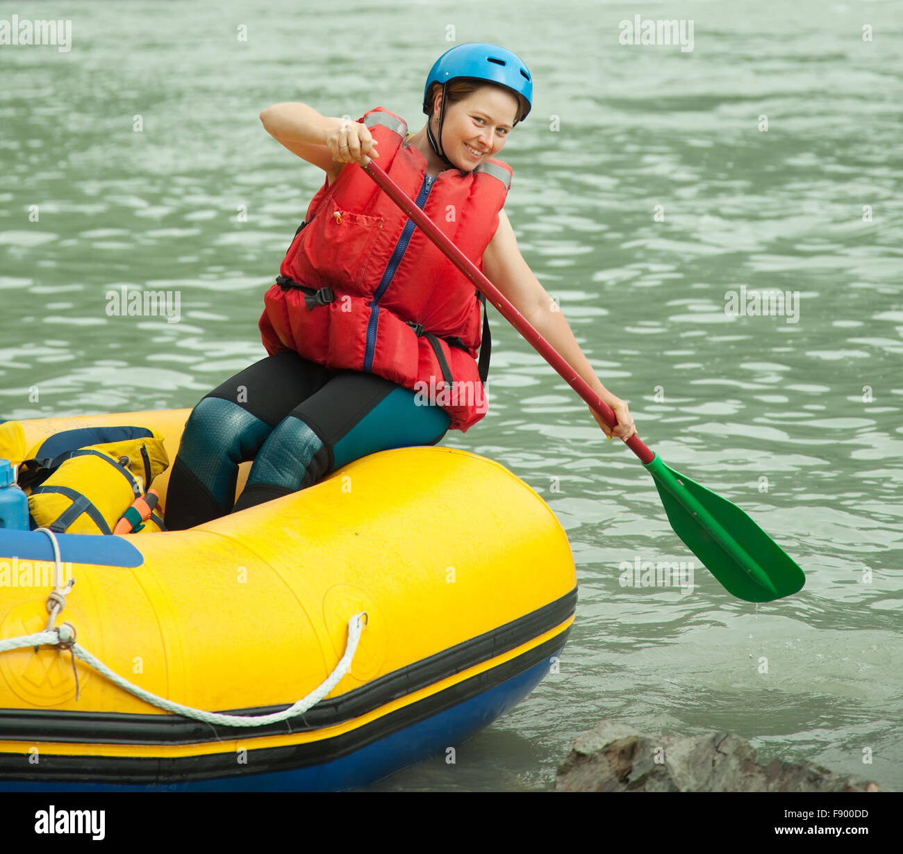 Girl with a paddle on the raft Stock Photo - Alamy