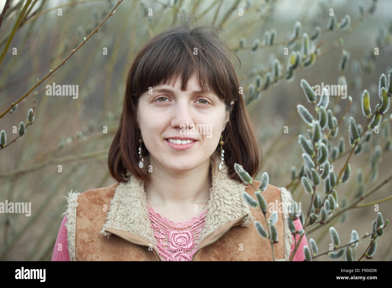 Smiling girl in spring willow twig with buds outdoor Stock Photo - Alamy