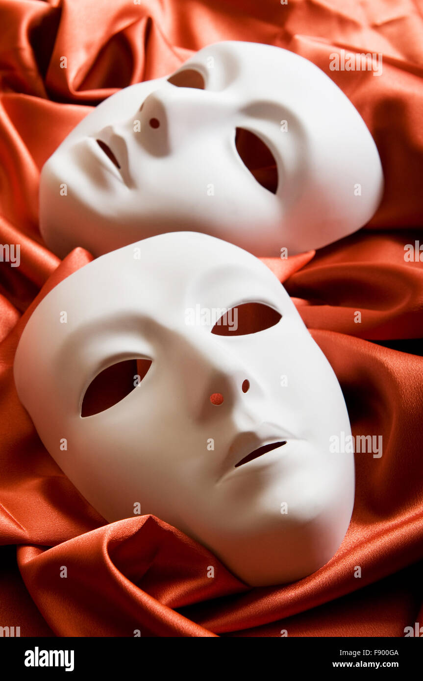 Theatre concept with the white plastic masks Stock Photo - Alamy
