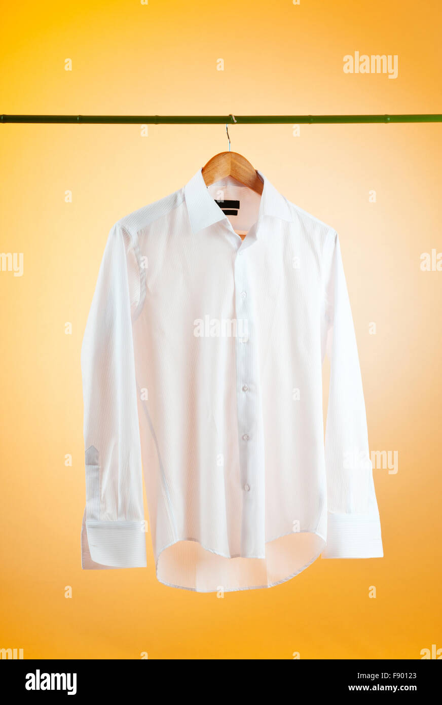Shirt hanging on the hanger Stock Photo - Alamy