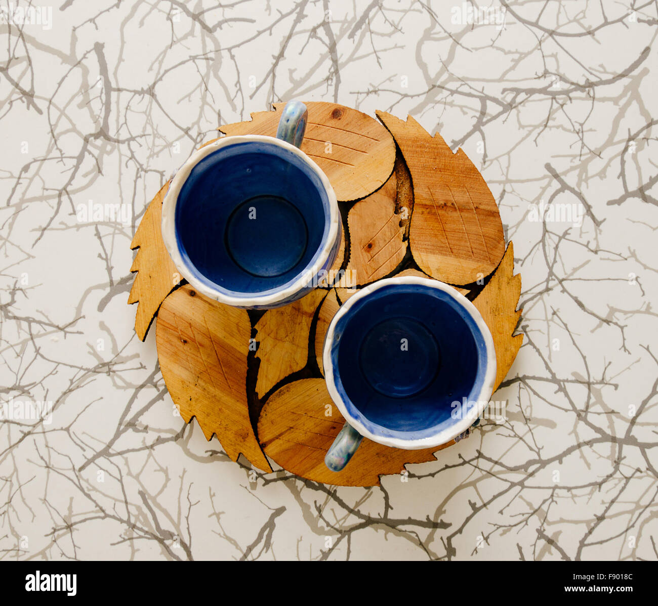 Two blue cups for tea time on the home kitchen table Stock Photo - Alamy
