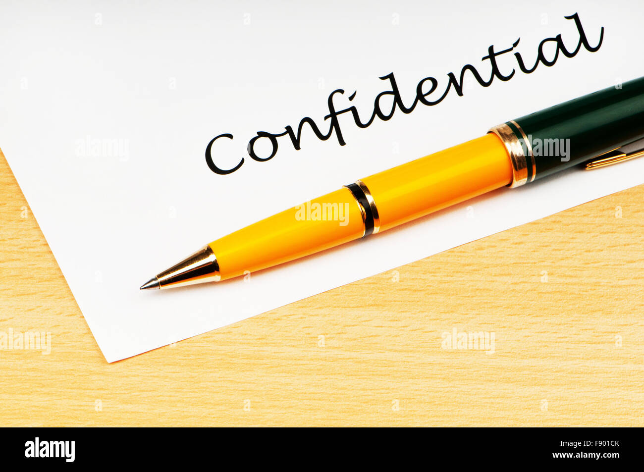 Pen and confidential message on white Stock Photo - Alamy