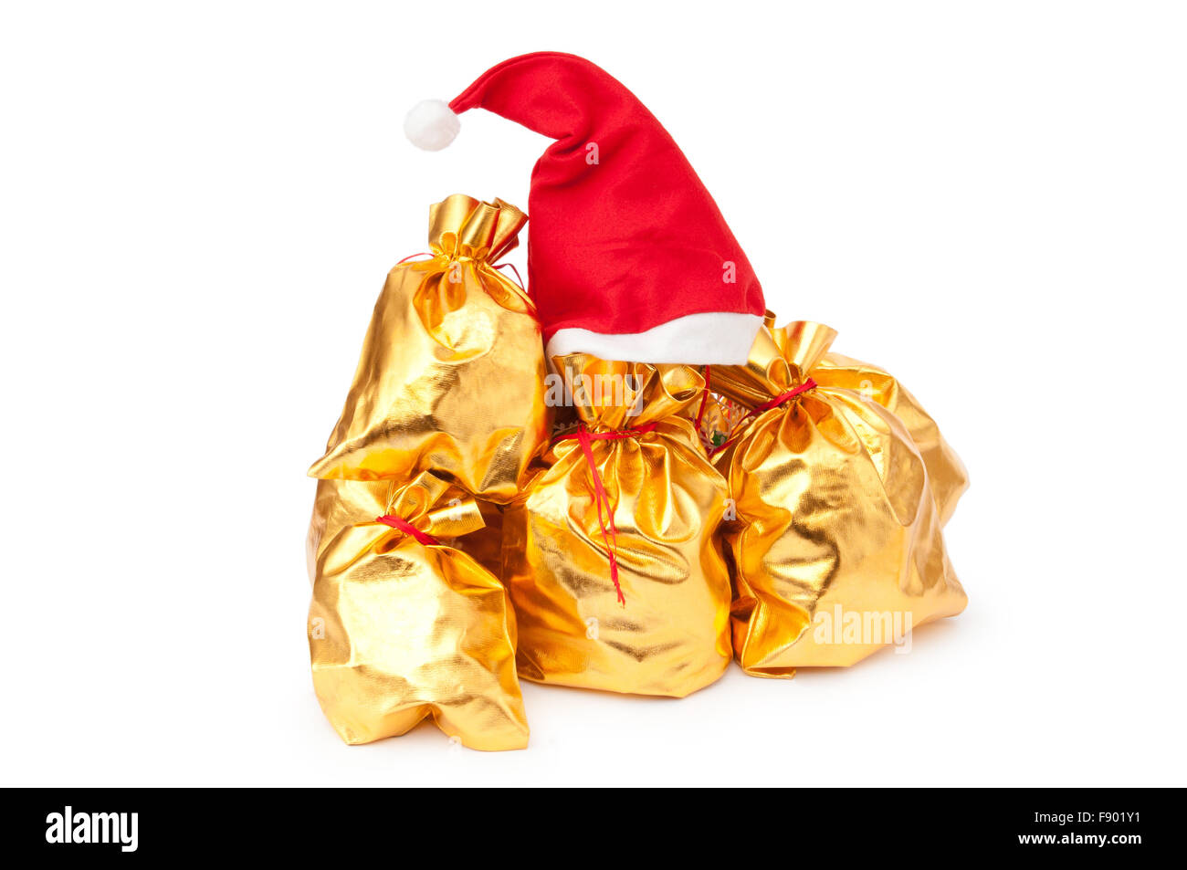 Golden sacks with santa hat Stock Photo - Alamy