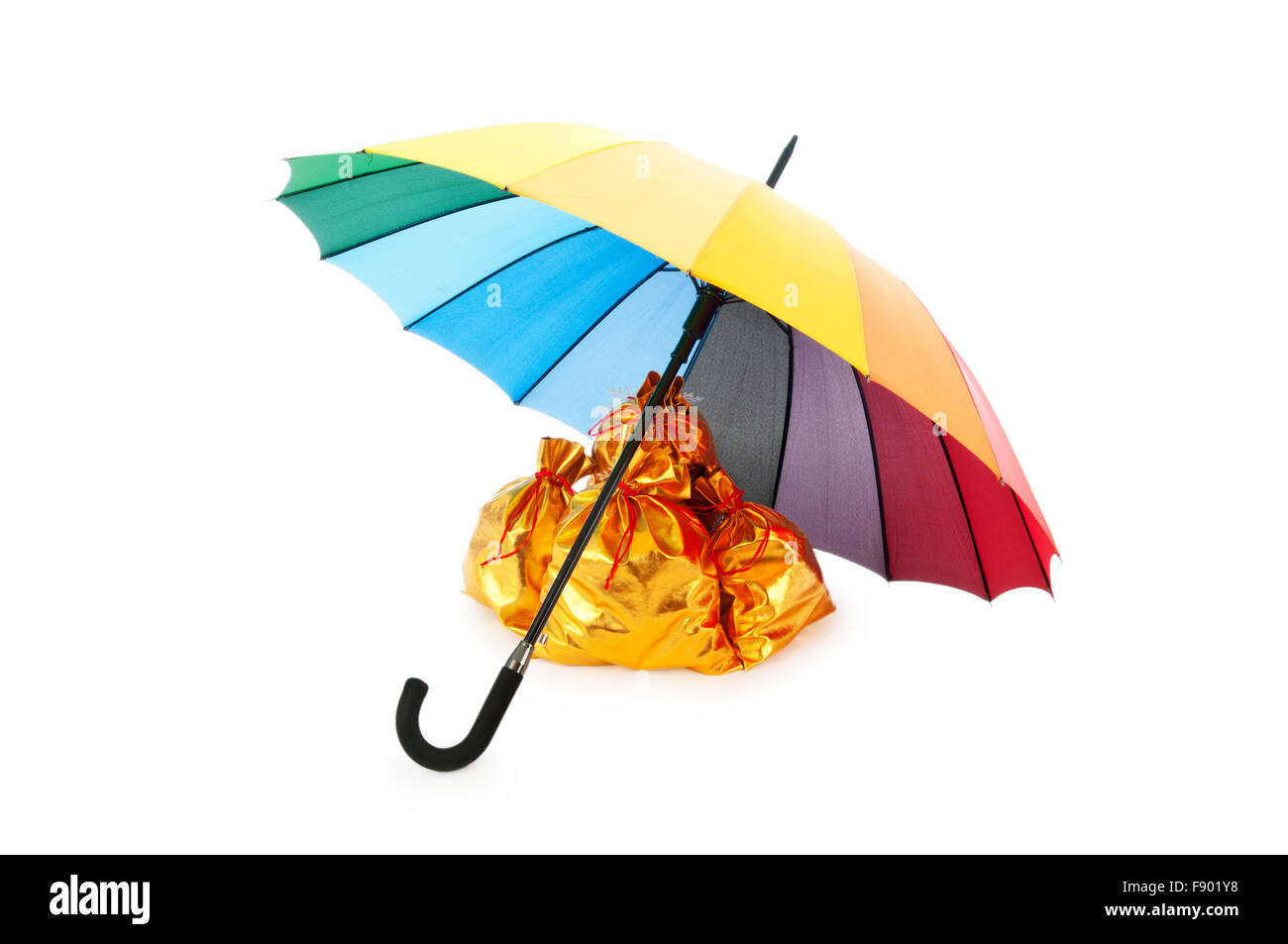 Golden sacks under protection of umbrella Stock Photo - Alamy