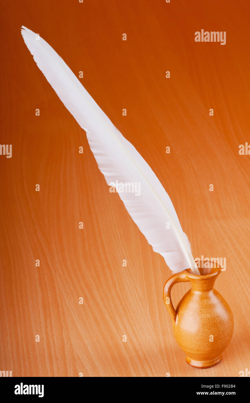 Writing feather against gradient background Stock Photo - Alamy