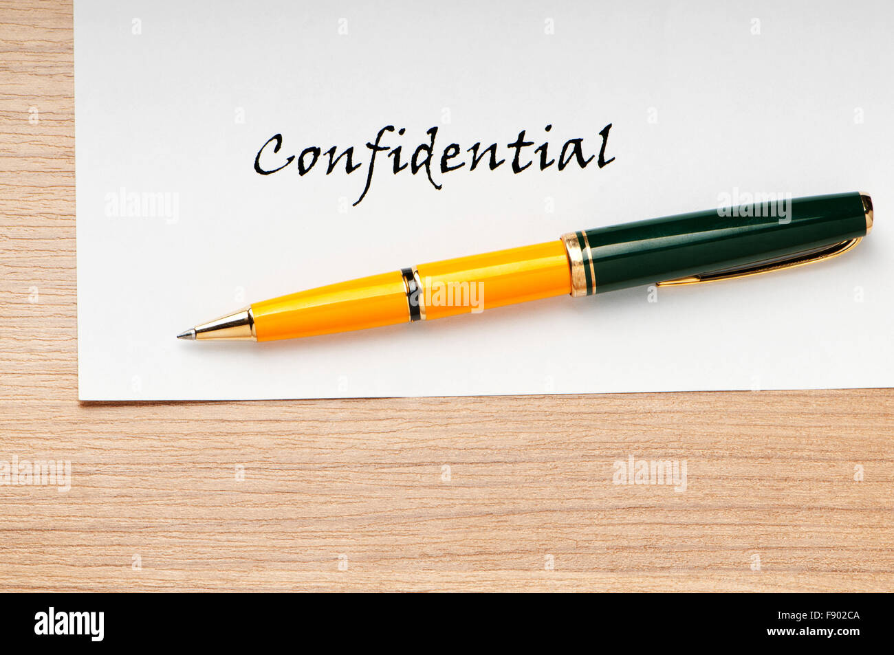 Pen and confidential message on white Stock Photo - Alamy