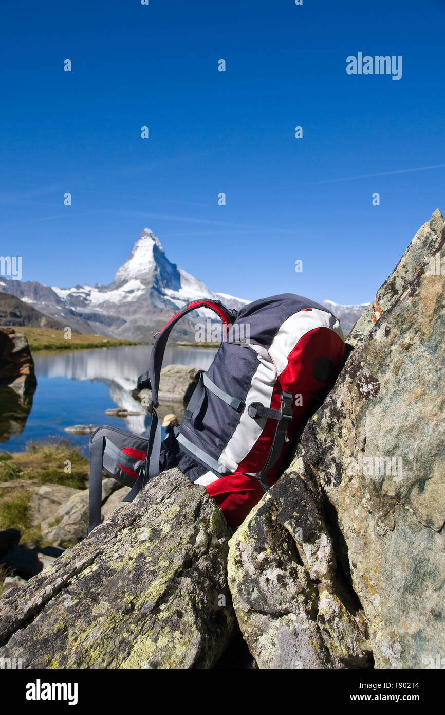 Backpack in front of the Matterhorn in the swiss alps Stock Photo - Alamy