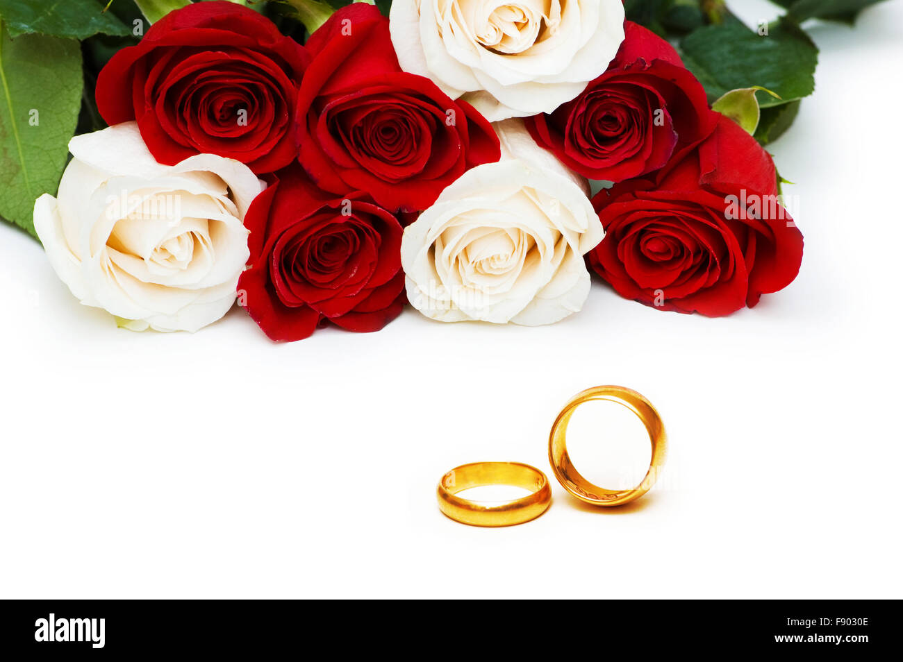 Wedding concept with roses and rings Stock Photo - Alamy