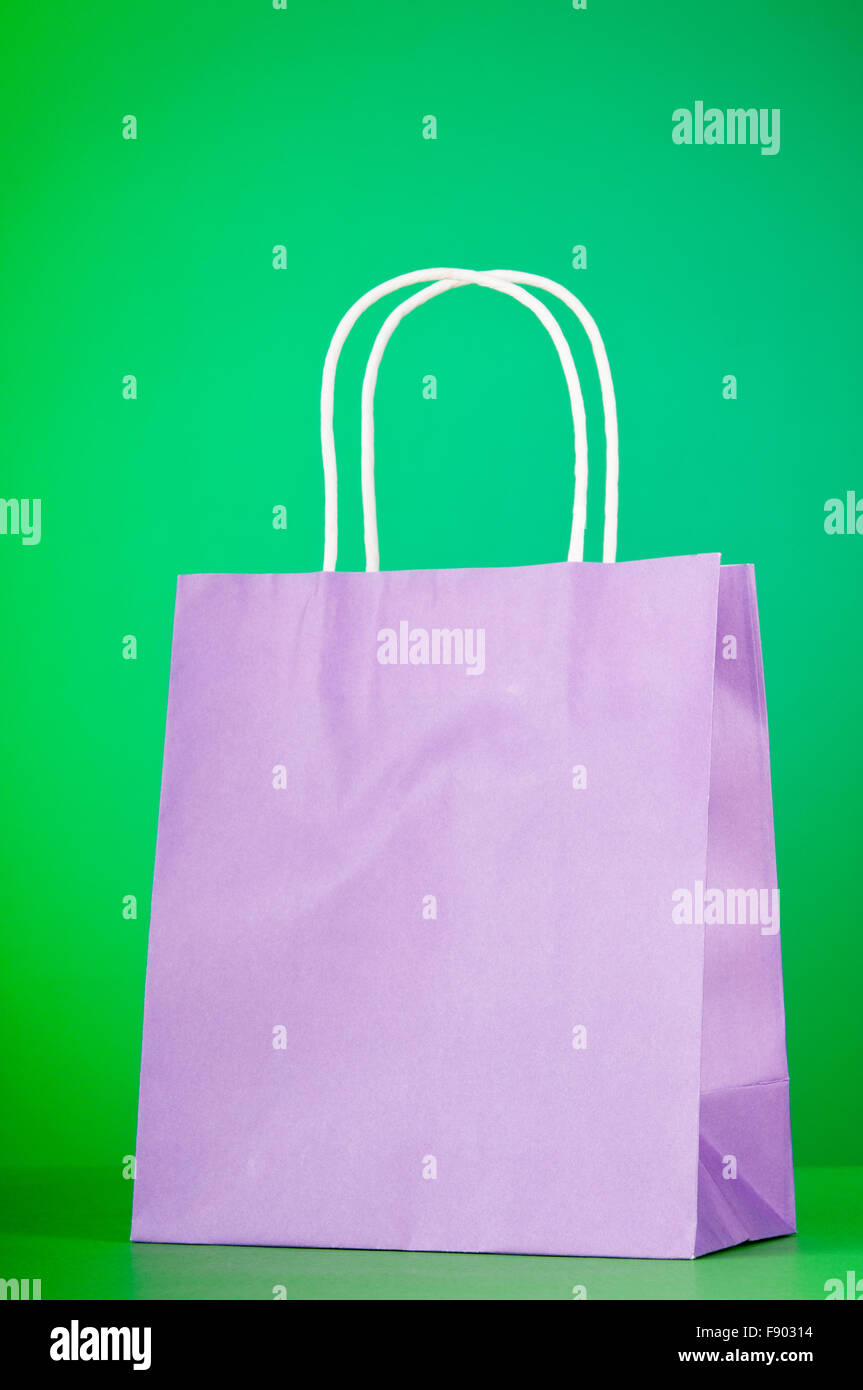 Colourful paper shopping bags against gradient background Stock Photo ...