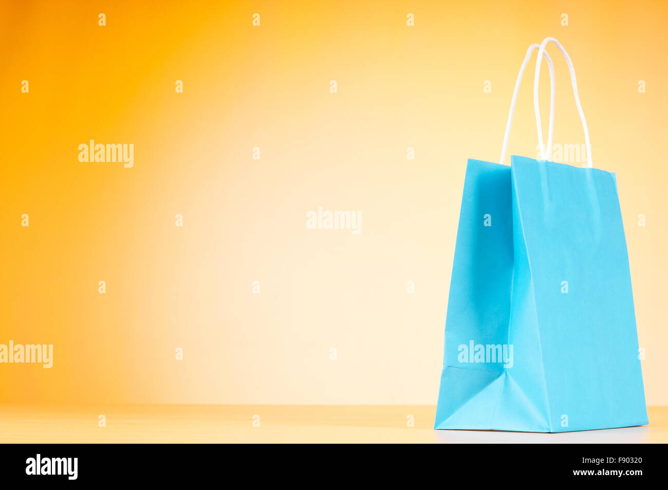 Colourful paper shopping bags against gradient background Stock Photo ...