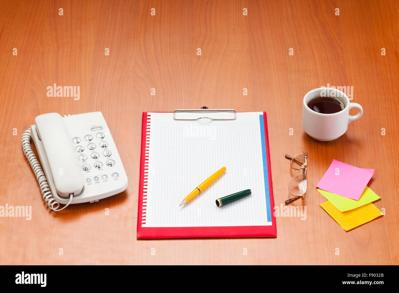 Desk top with many items Stock Photo - Alamy