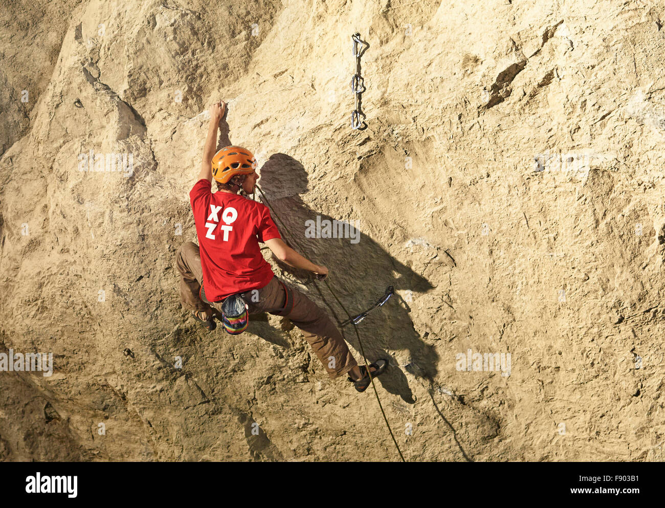 Climber lead climbing on a rock face, Martinswand, Zirl, Tyrol, Austria ...