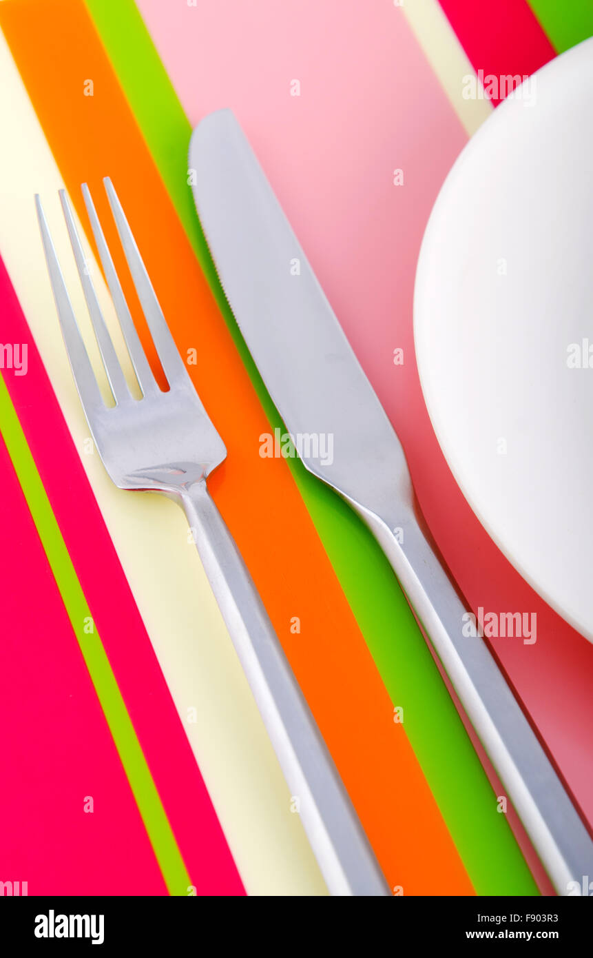 Empty plate with utensils Stock Photo - Alamy