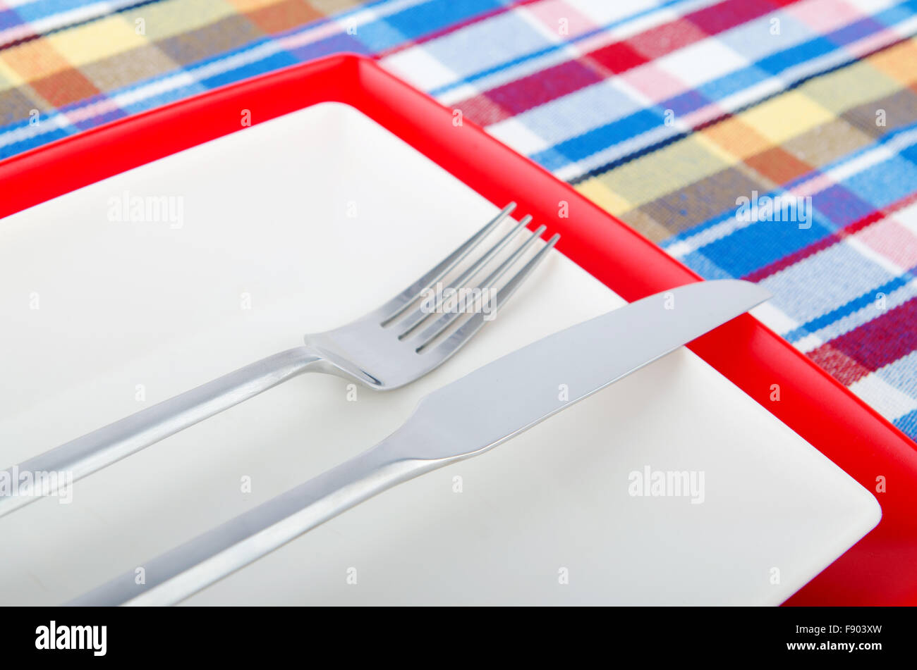 Empty plate with utensils Stock Photo - Alamy