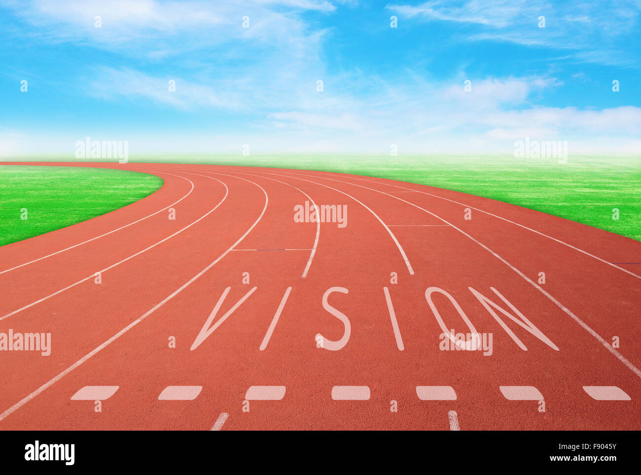 empty outdoor running track with sign vision with blue sky background ...