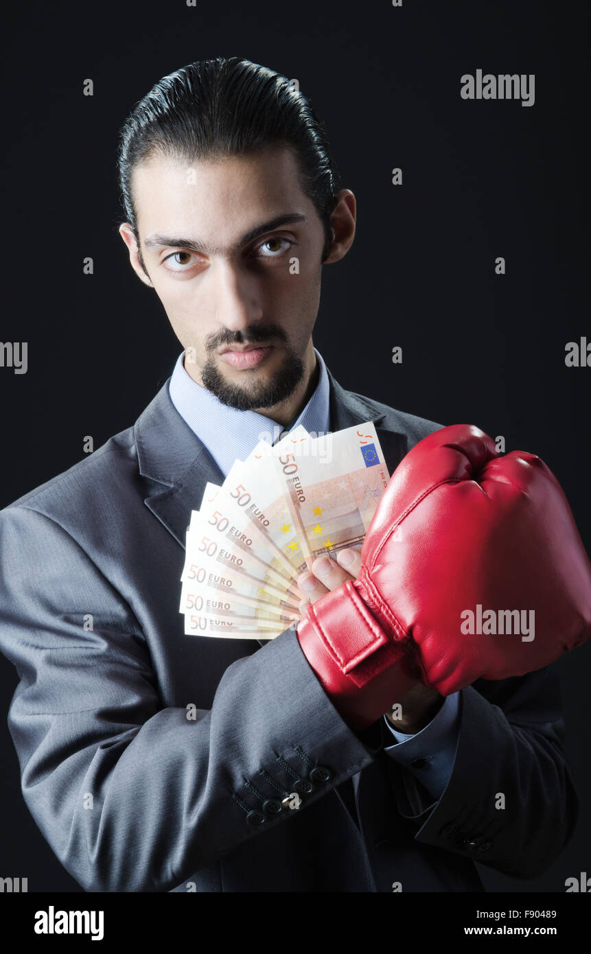 Man with boxing gloves and money Stock Photo - Alamy
