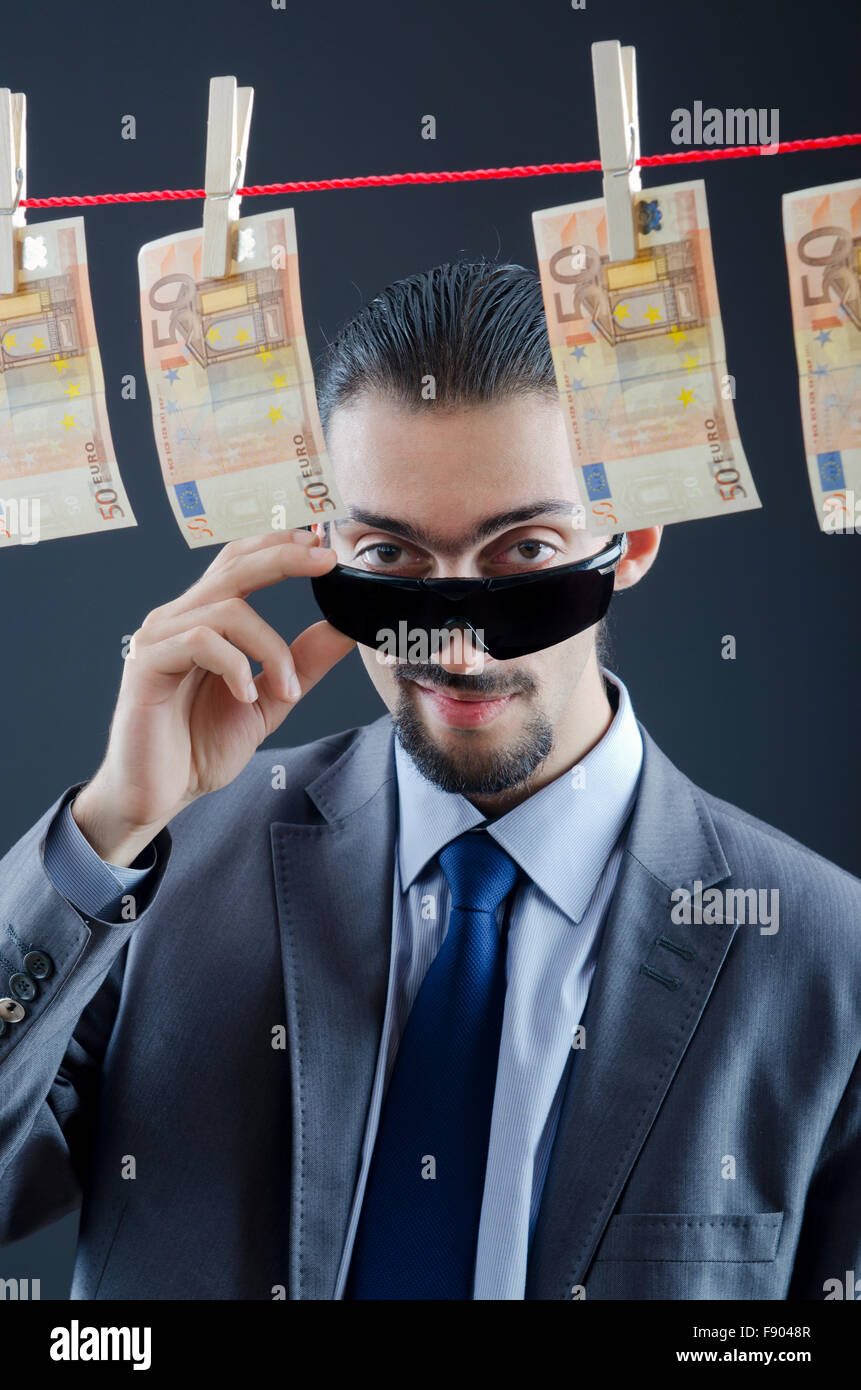 Money laundering dollars bills greed hi-res stock photography and ...