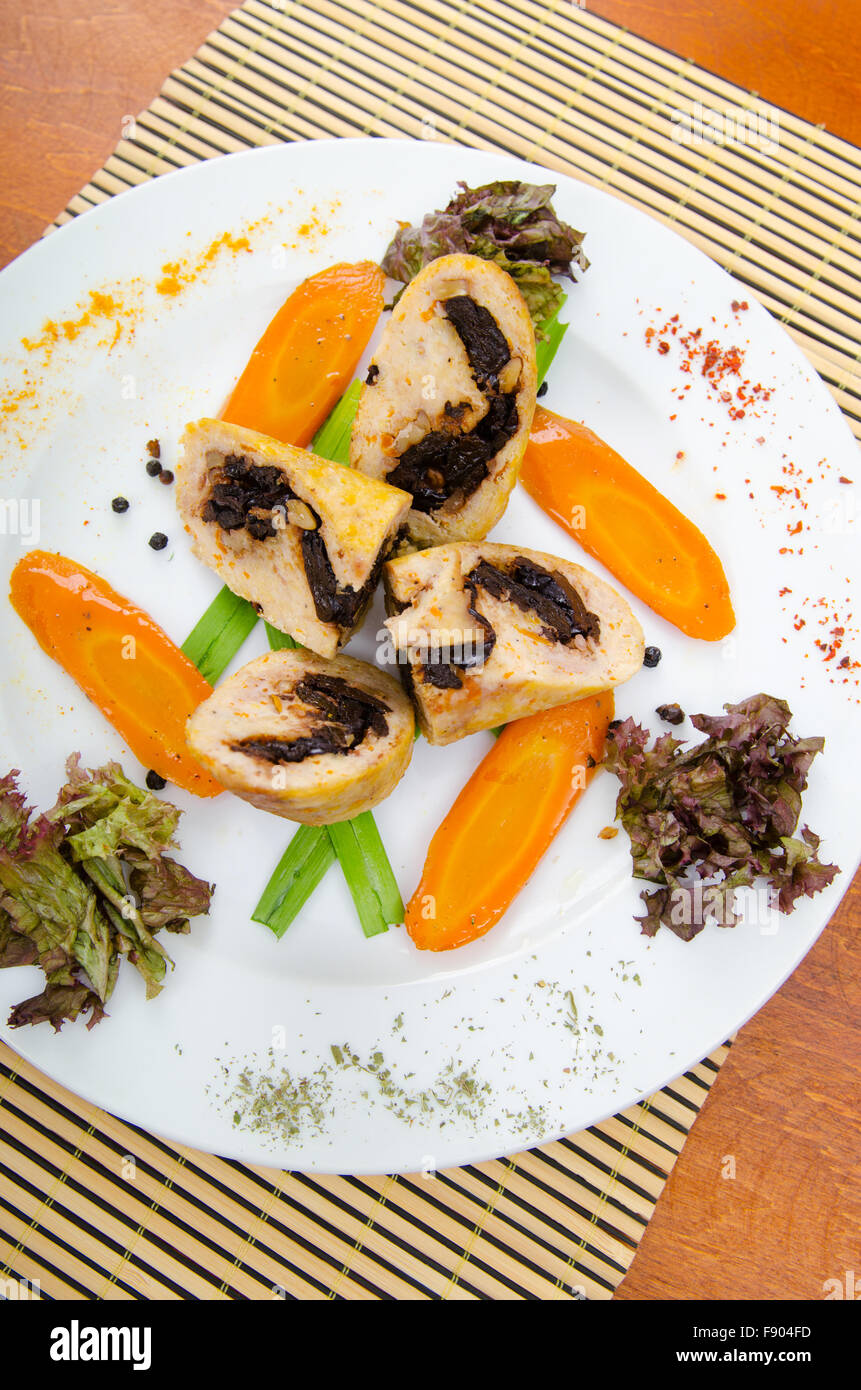 Meat and vegetable roll in plate Stock Photo - Alamy