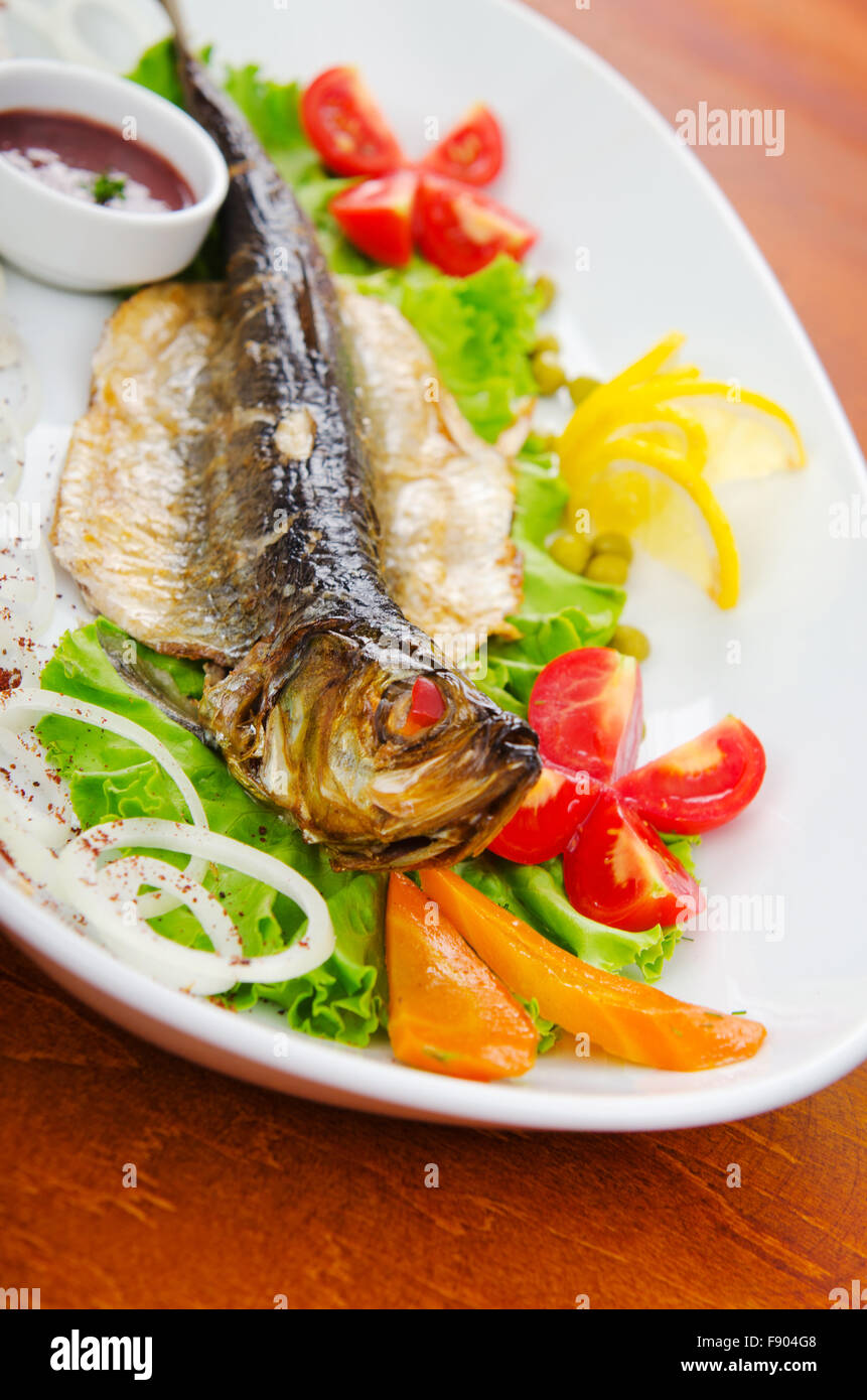 Fried fish in the plate Stock Photo - Alamy