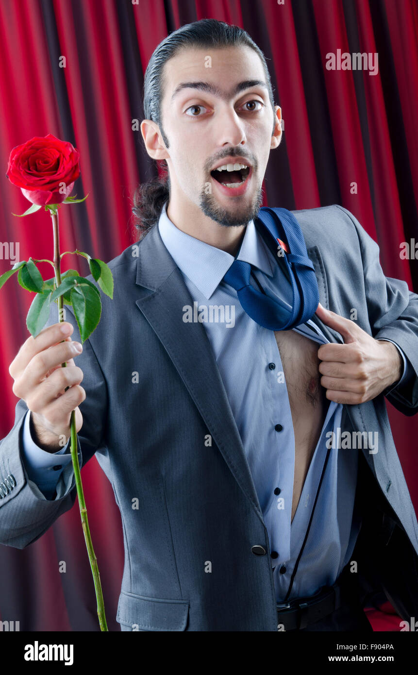 Young man with red rose Stock Photo - Alamy