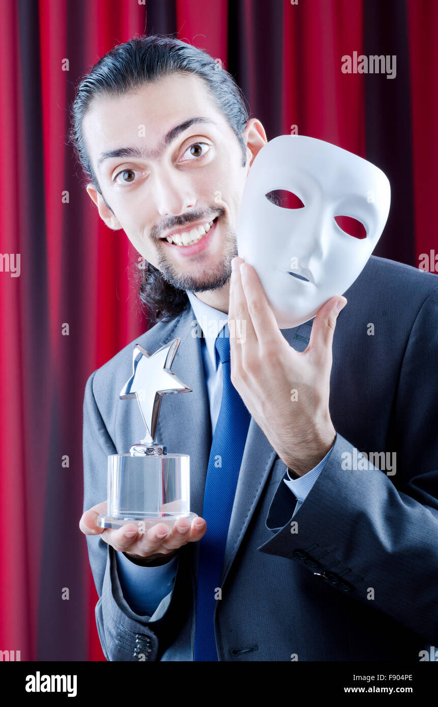 Man receiving award in mask Stock Photo - Alamy
