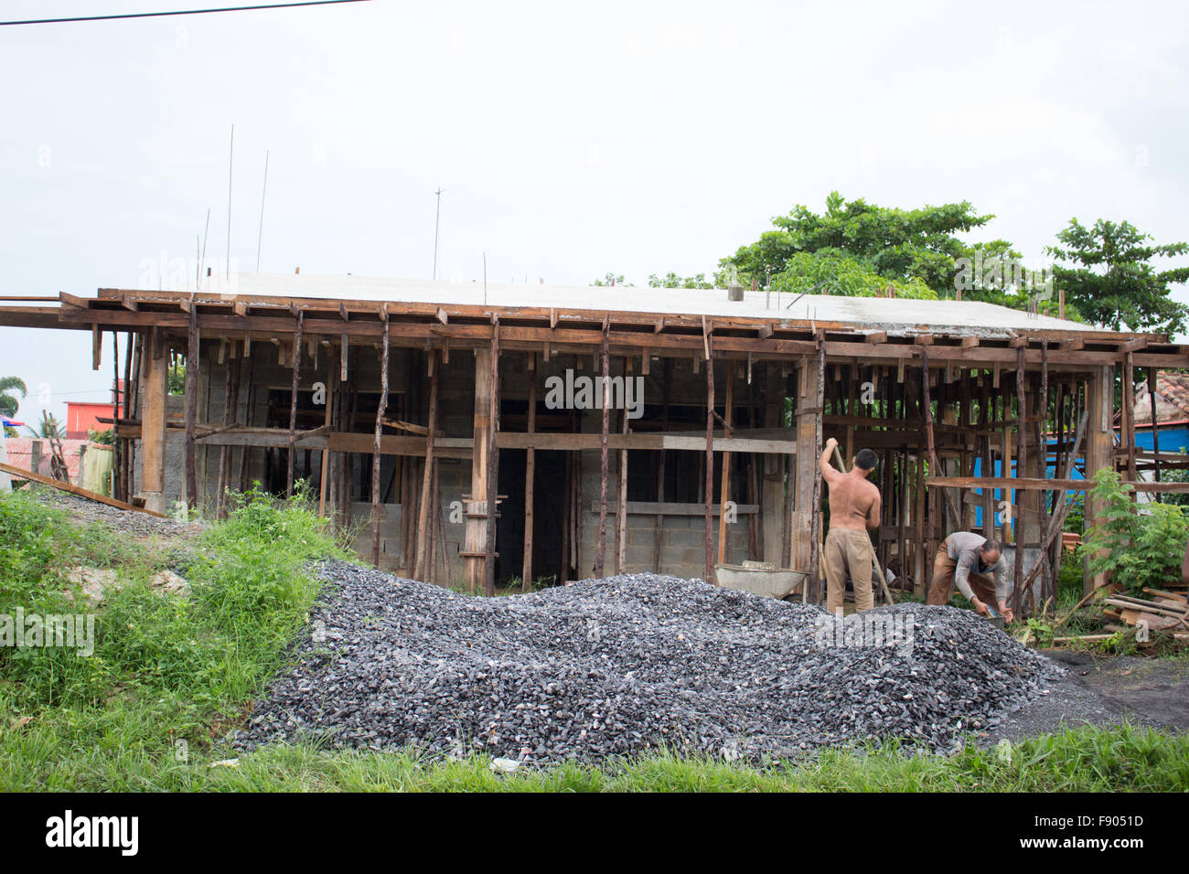 Men building again their house after a hurricane Stock Photo - Alamy