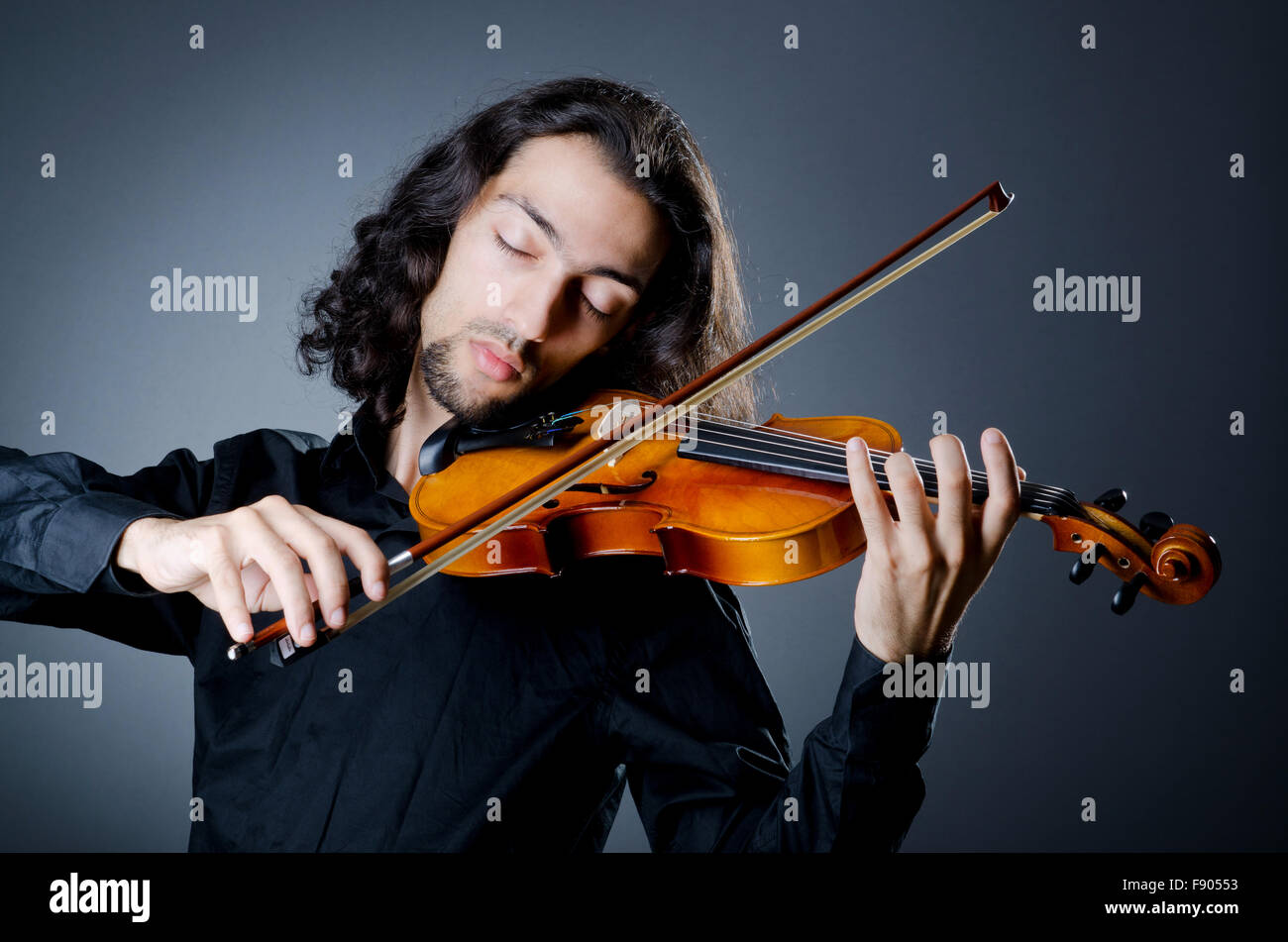 Violin player playing the intstrument Stock Photo - Alamy