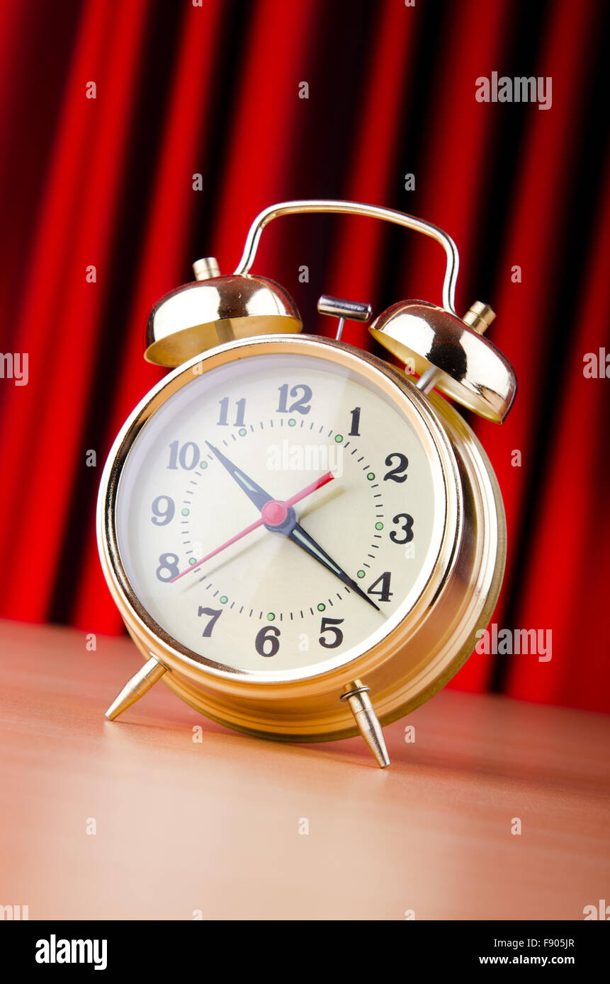 Time concept with alarm clock Stock Photo - Alamy