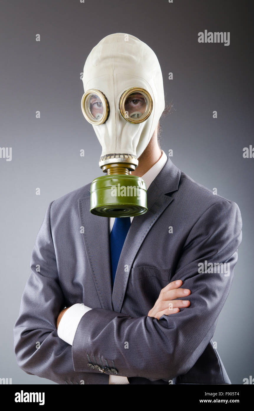 Businessman wearing gas mask Stock Photo - Alamy