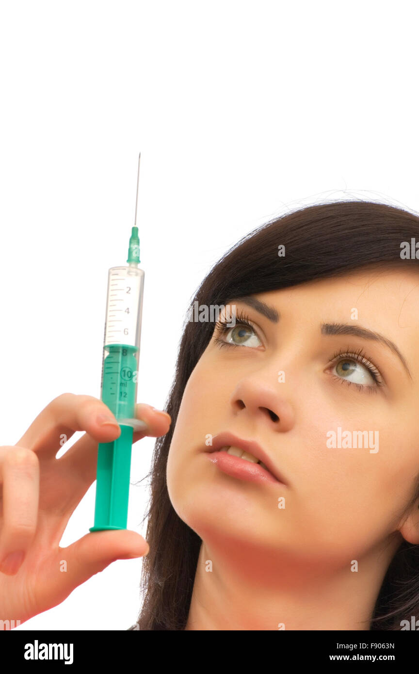 Woman checking syringe isolated on the white Stock Photo - Alamy