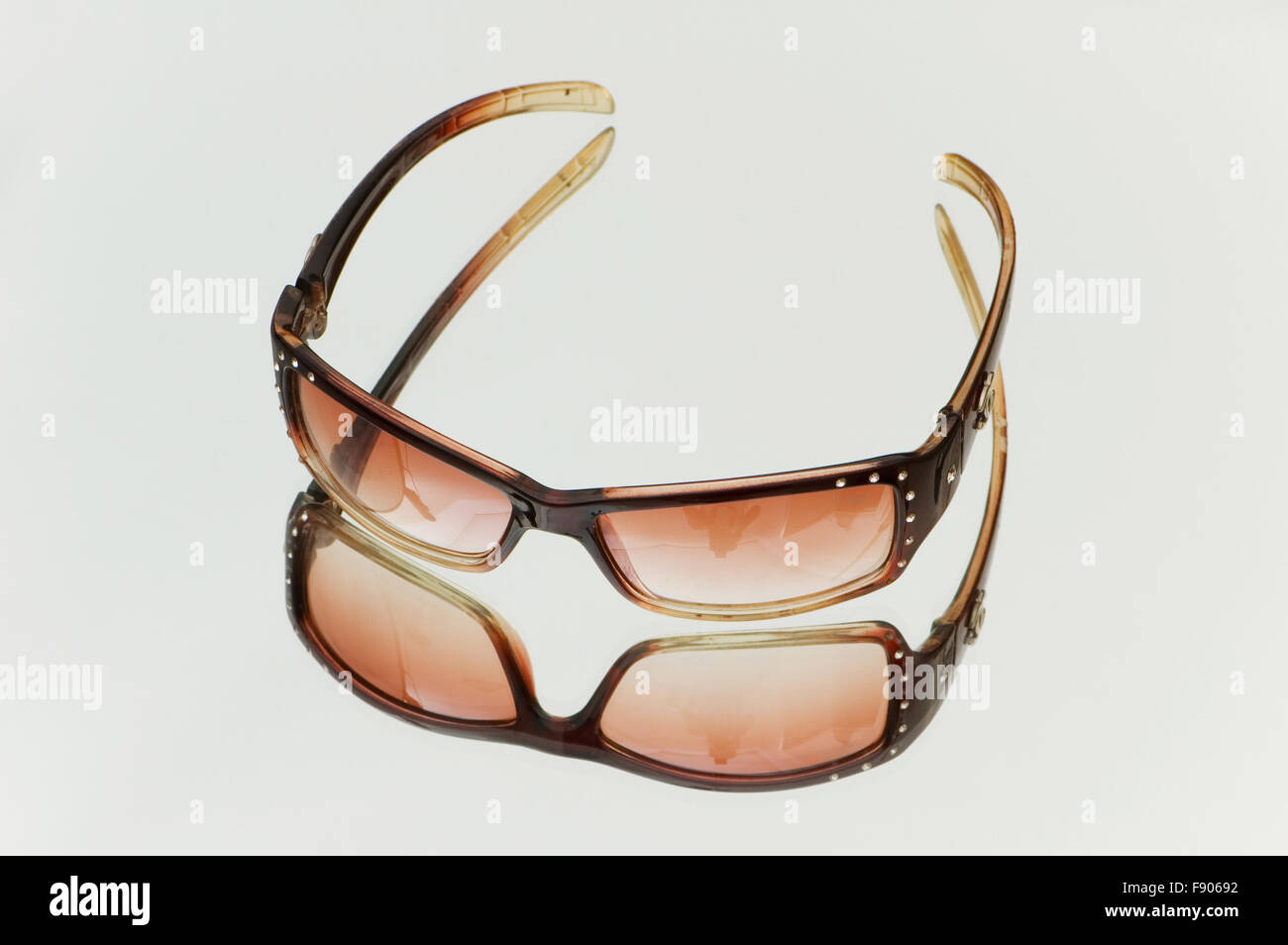 Stylish sun glasses on highly reflective background Stock Photo - Alamy