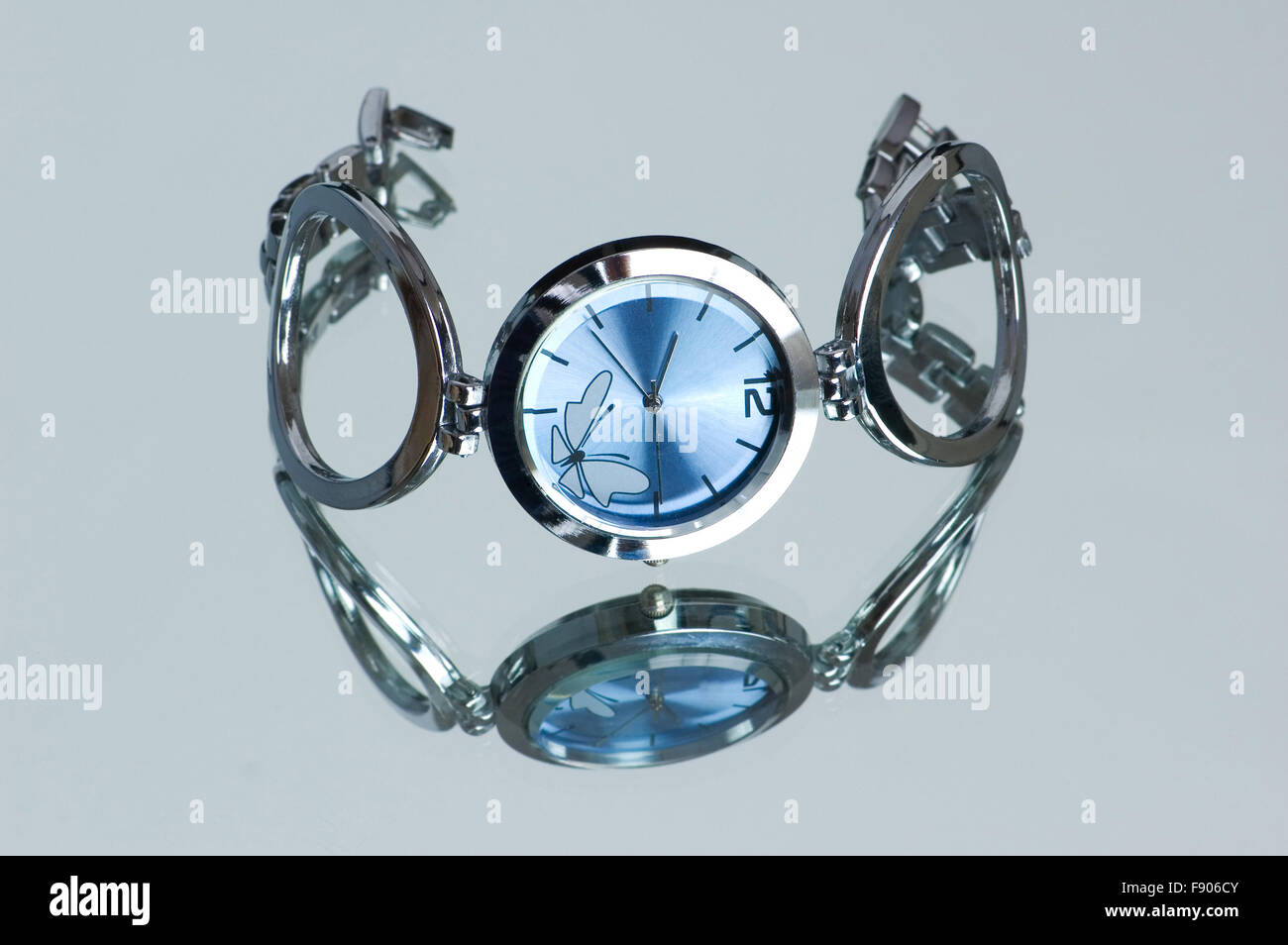 Stylish hand watch on the reflective background Stock Photo - Alamy