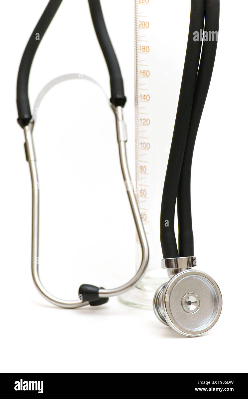 Stethoscope and measuring glass isolated on white Stock Photo - Alamy