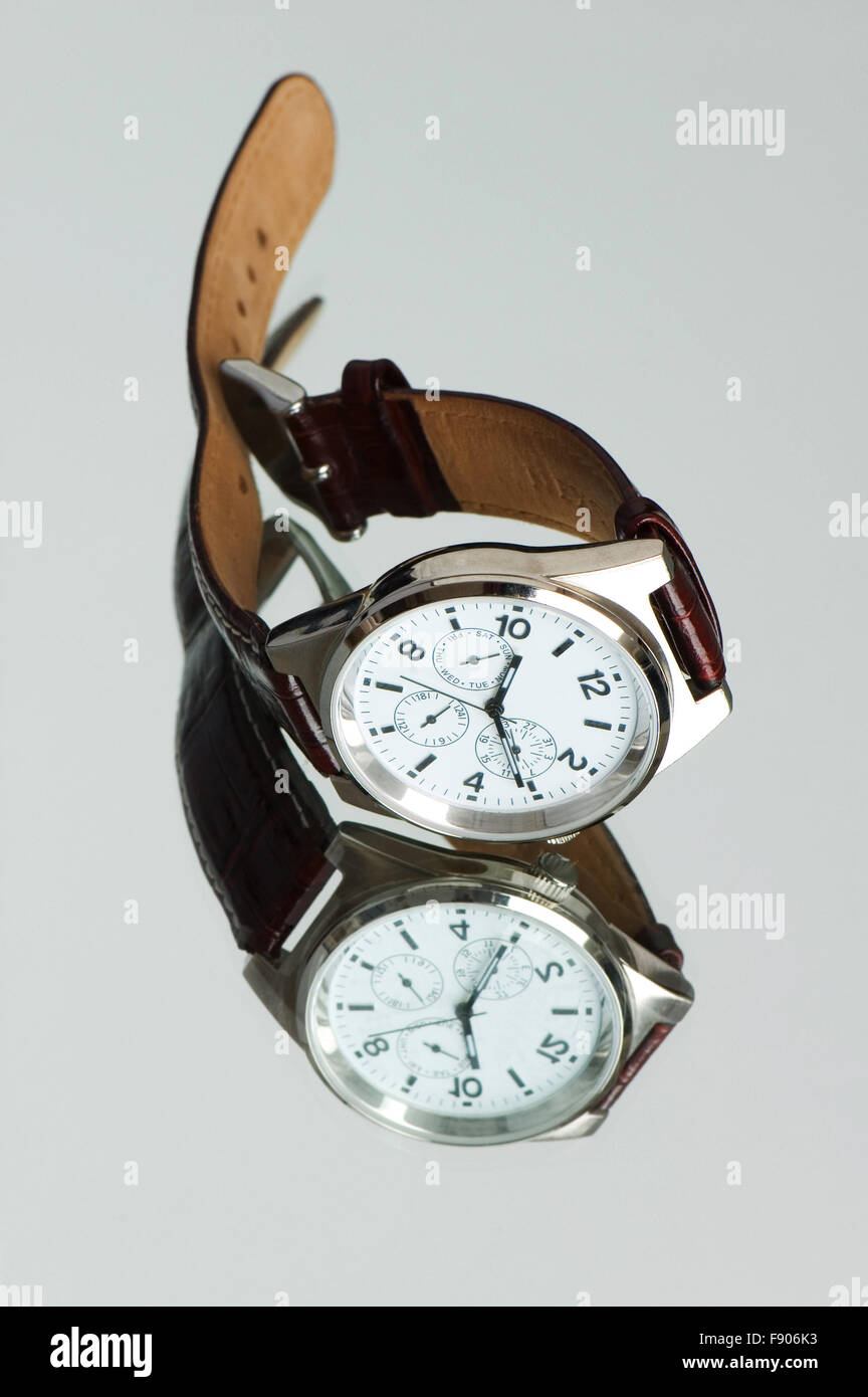 Stylish hand watch on the reflective background Stock Photo - Alamy