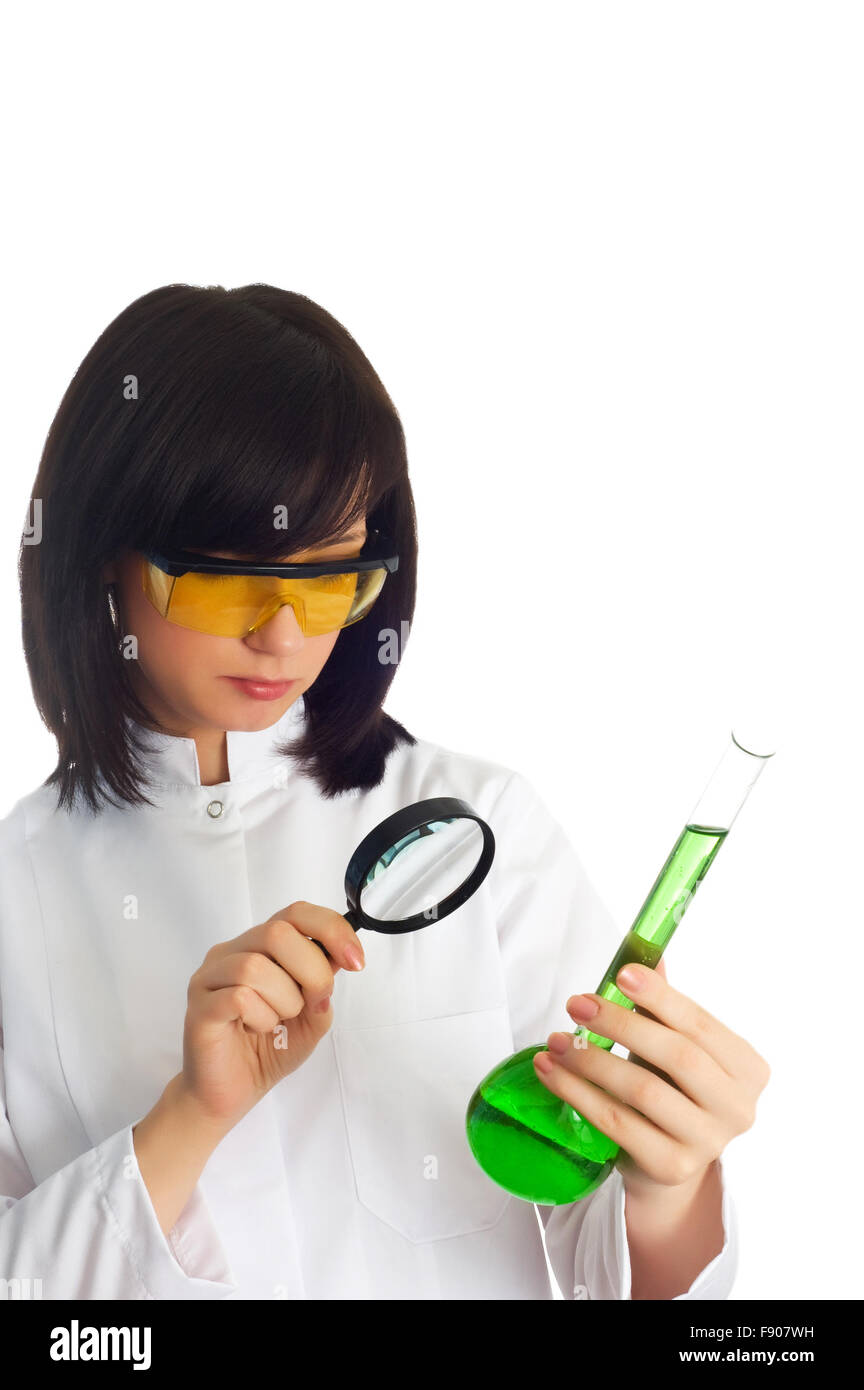 Female scientist looking at tube through magnifying lens Stock Photo ...