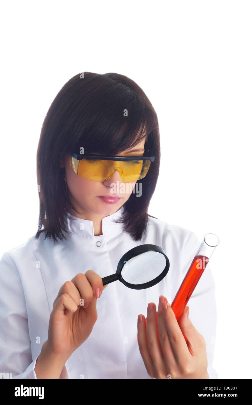 Female scientist looking at tube through magnifying lens Stock Photo ...